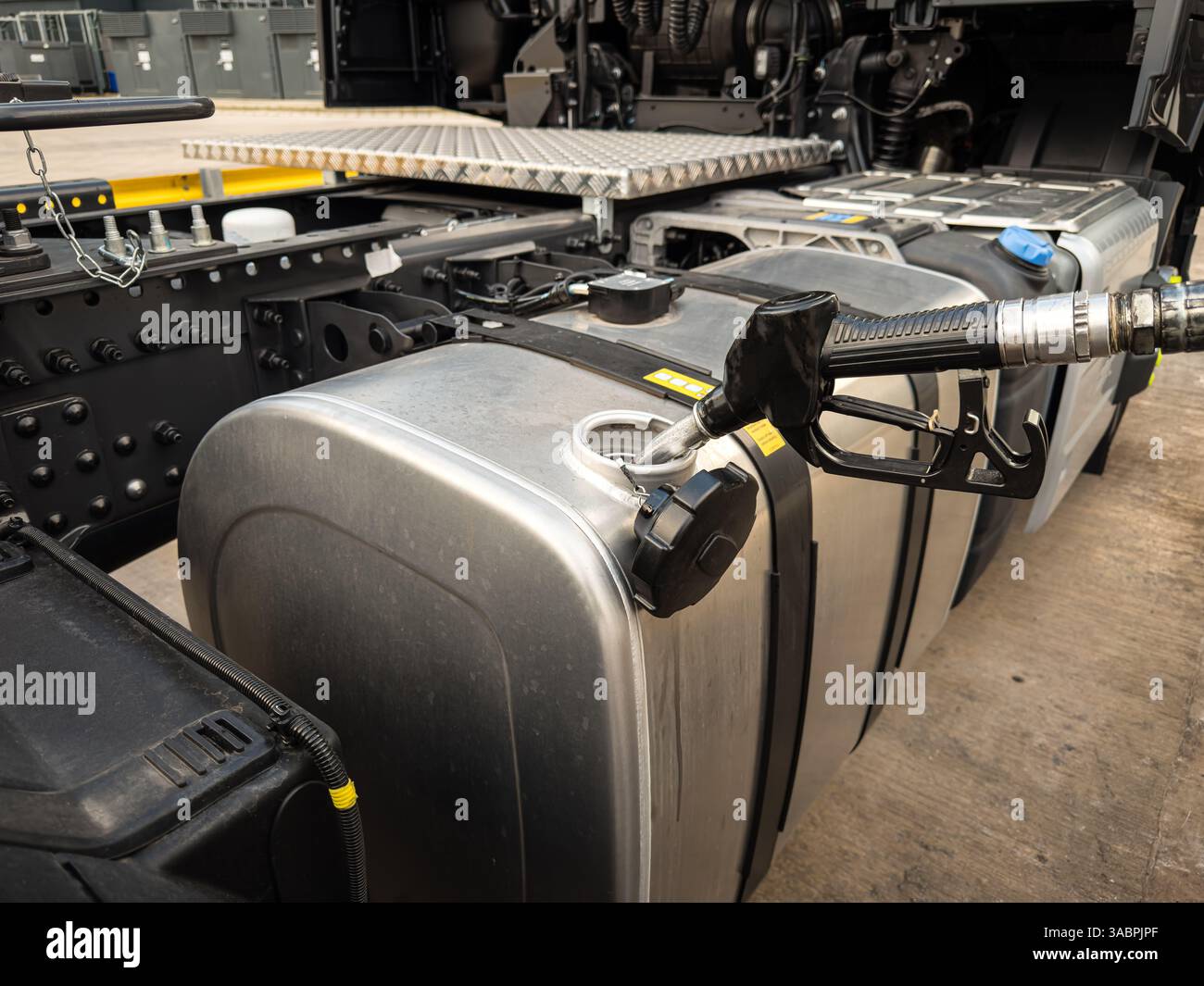 Lorry fill up with diesel. refuelling diesel to lorry tank, large hose ...