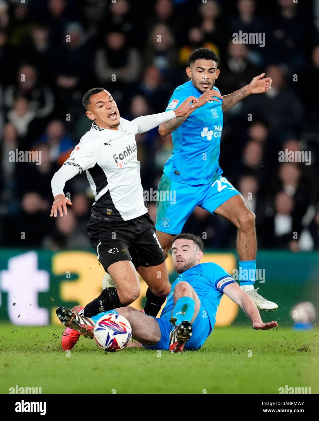 Derby County's Kayden Jackson (left) is tackled by Preston North End's ...