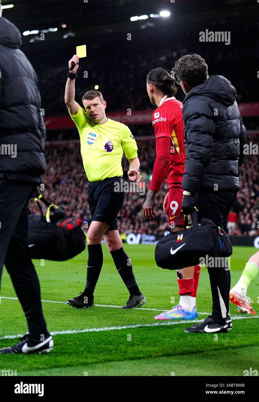 Liverpool's Darwin Nunez is shown a yellow card by referee Sam Barrott ...