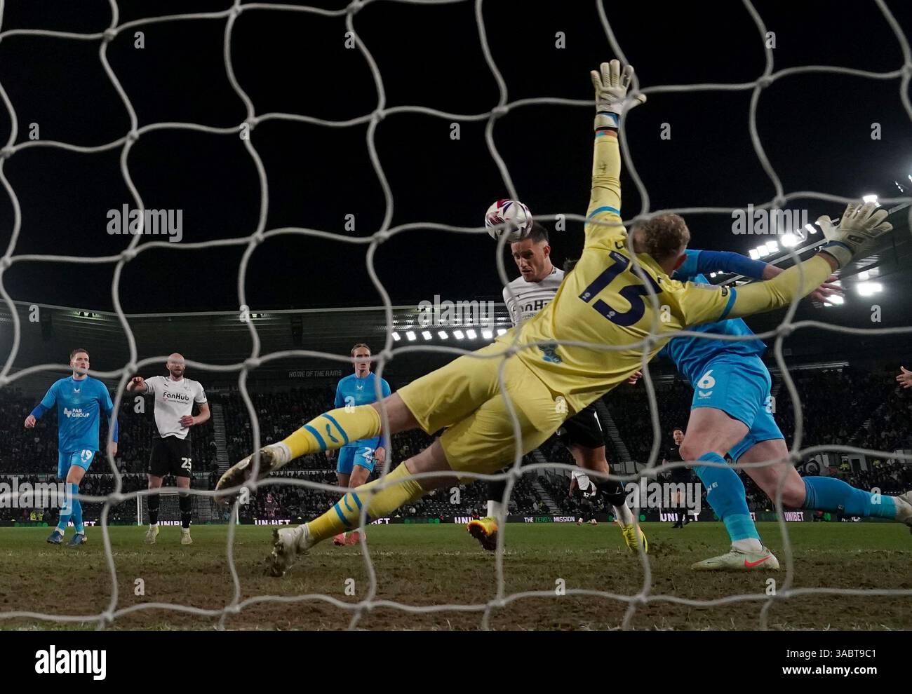 Derby County's Jerry Yates (centre rear) scores his sides second goal ...