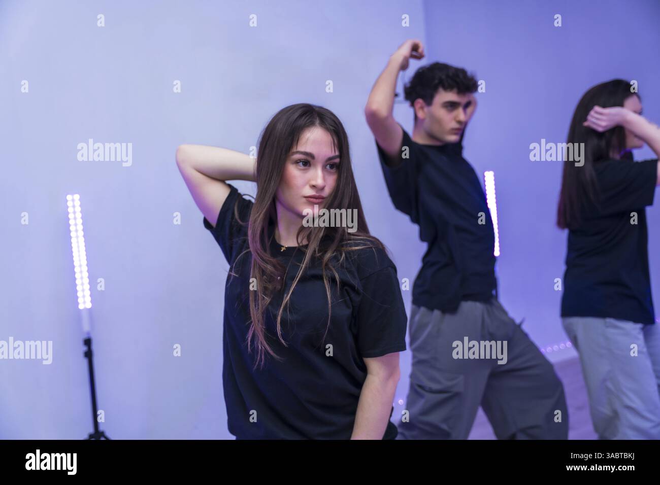 Group of young dancers practicing a modern choreography in a dance ...