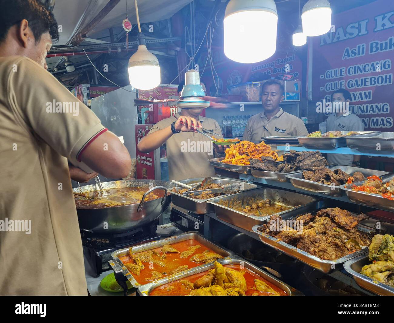 Scene at a Nasi Padang or Nasi Kapau street food restaurant in Jakarta ...