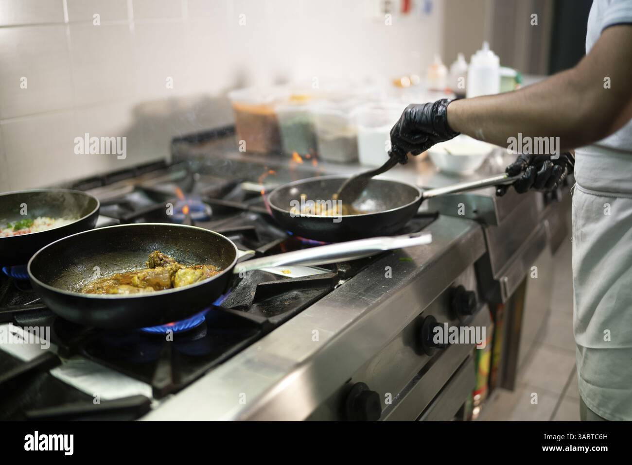 Chef skillfully stir frying ingredients hi-res stock photography and ...