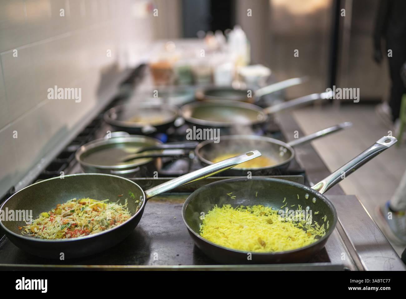 Professional chefs cooking rice hi-res stock photography and images - Alamy