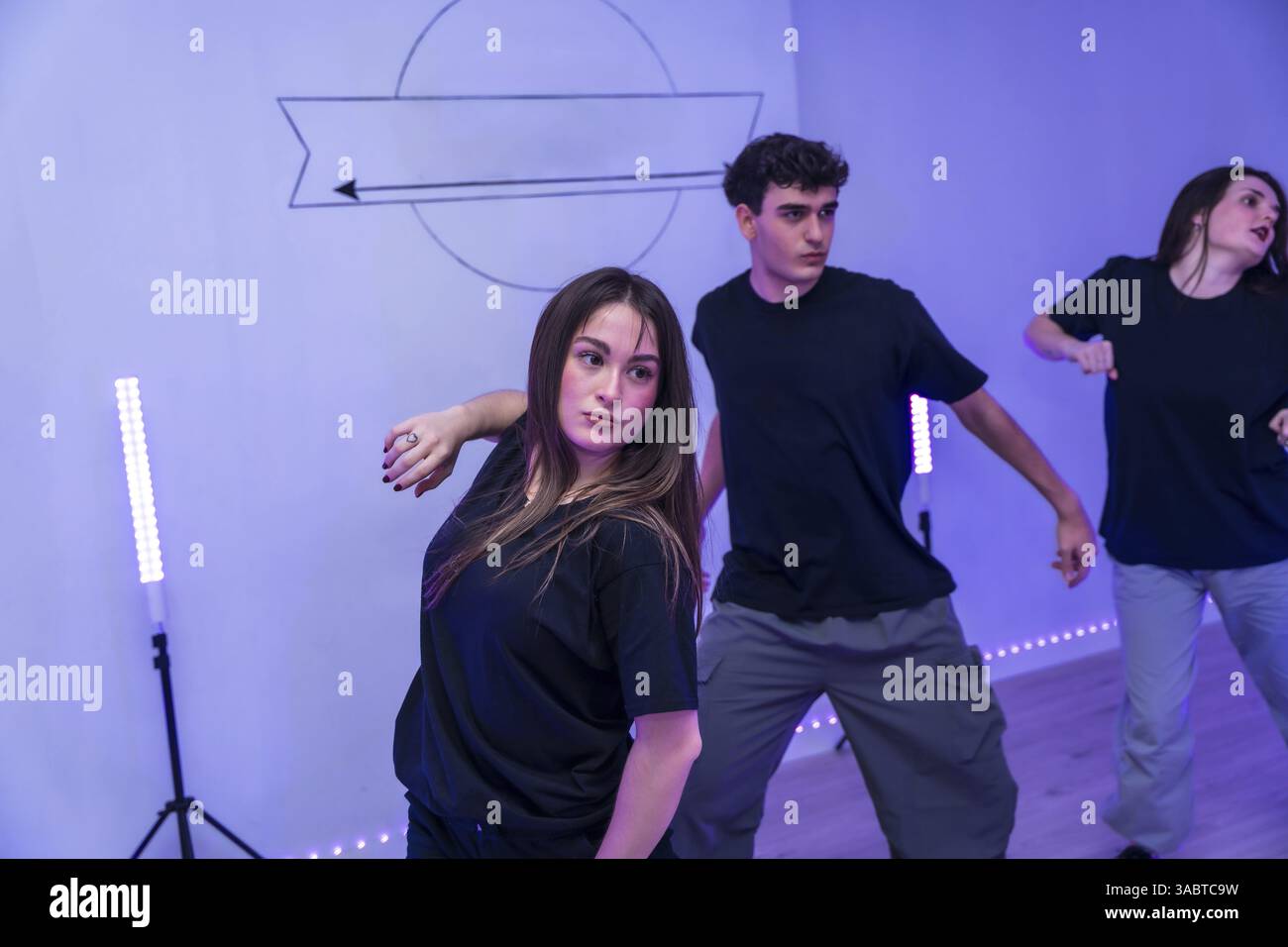 Group of young dancers practicing a modern choreography in a dance ...