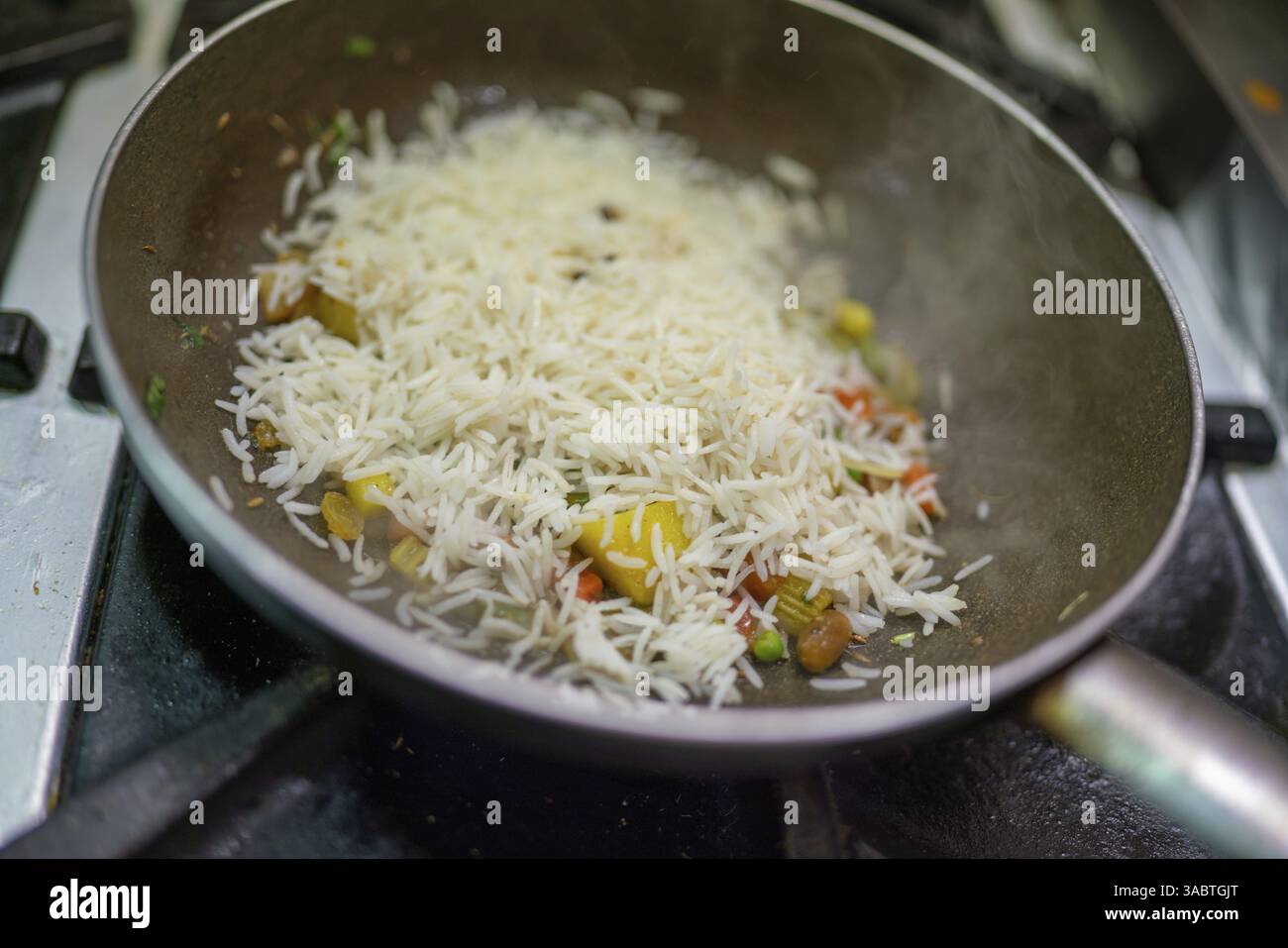 Professional chef preparing vegetable biryani, an indian mixed rice ...