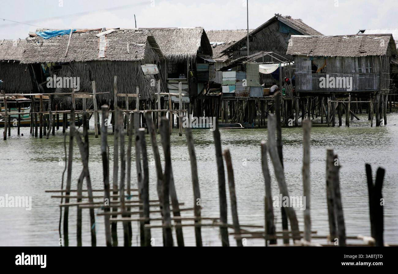 Oct 24, 2007 - Tawi Tawi, Philippines - A group of houses sit above the ...