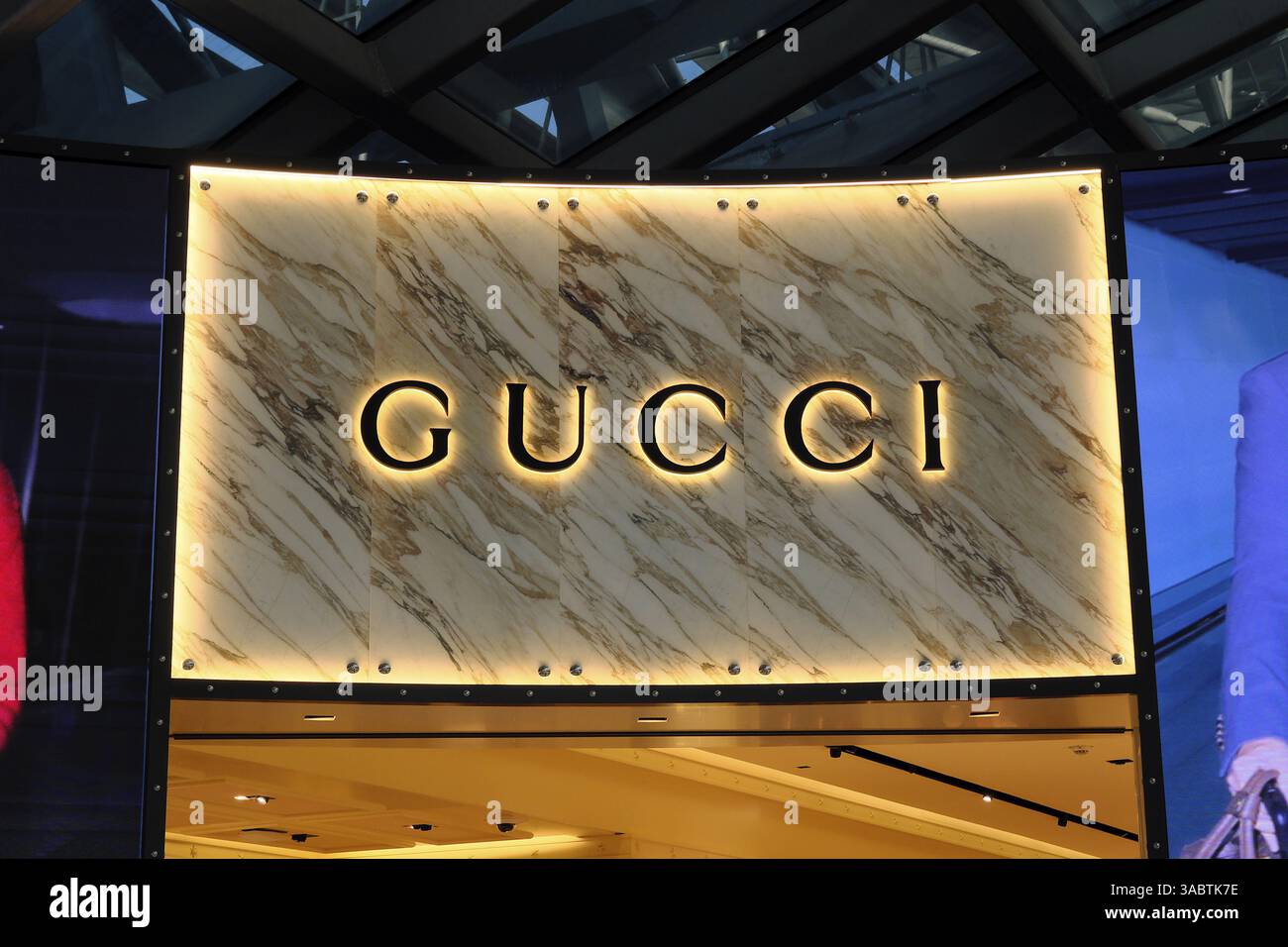 Company logo of the luxury brand Gucci in the departure area of Bangkok ...