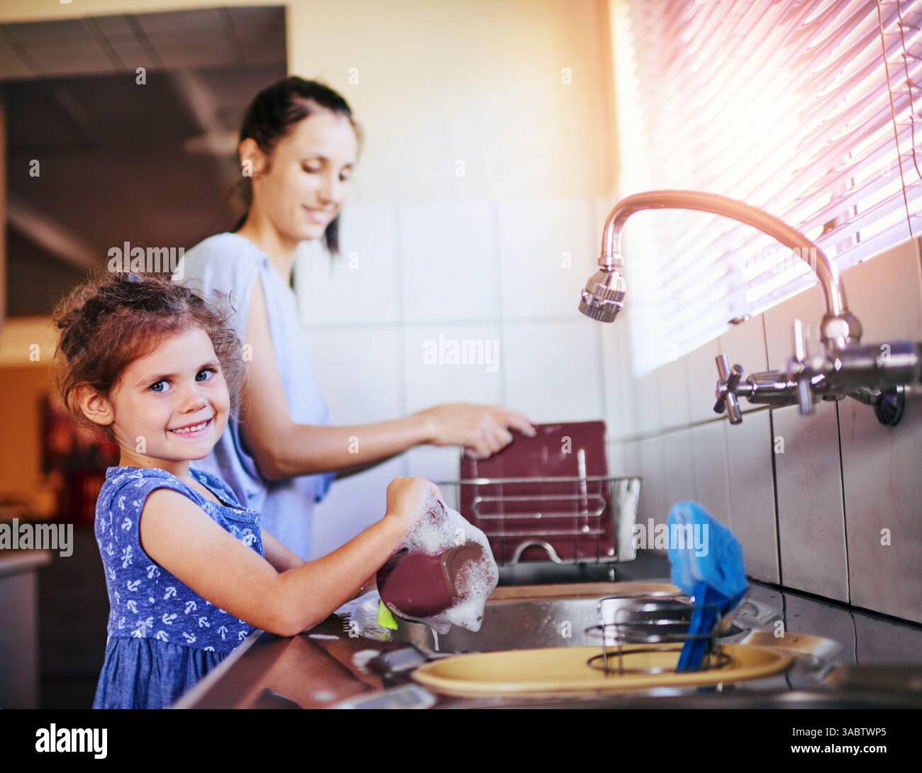 Mother, girl and portrait for cleaning dishes in home, learning hygiene ...