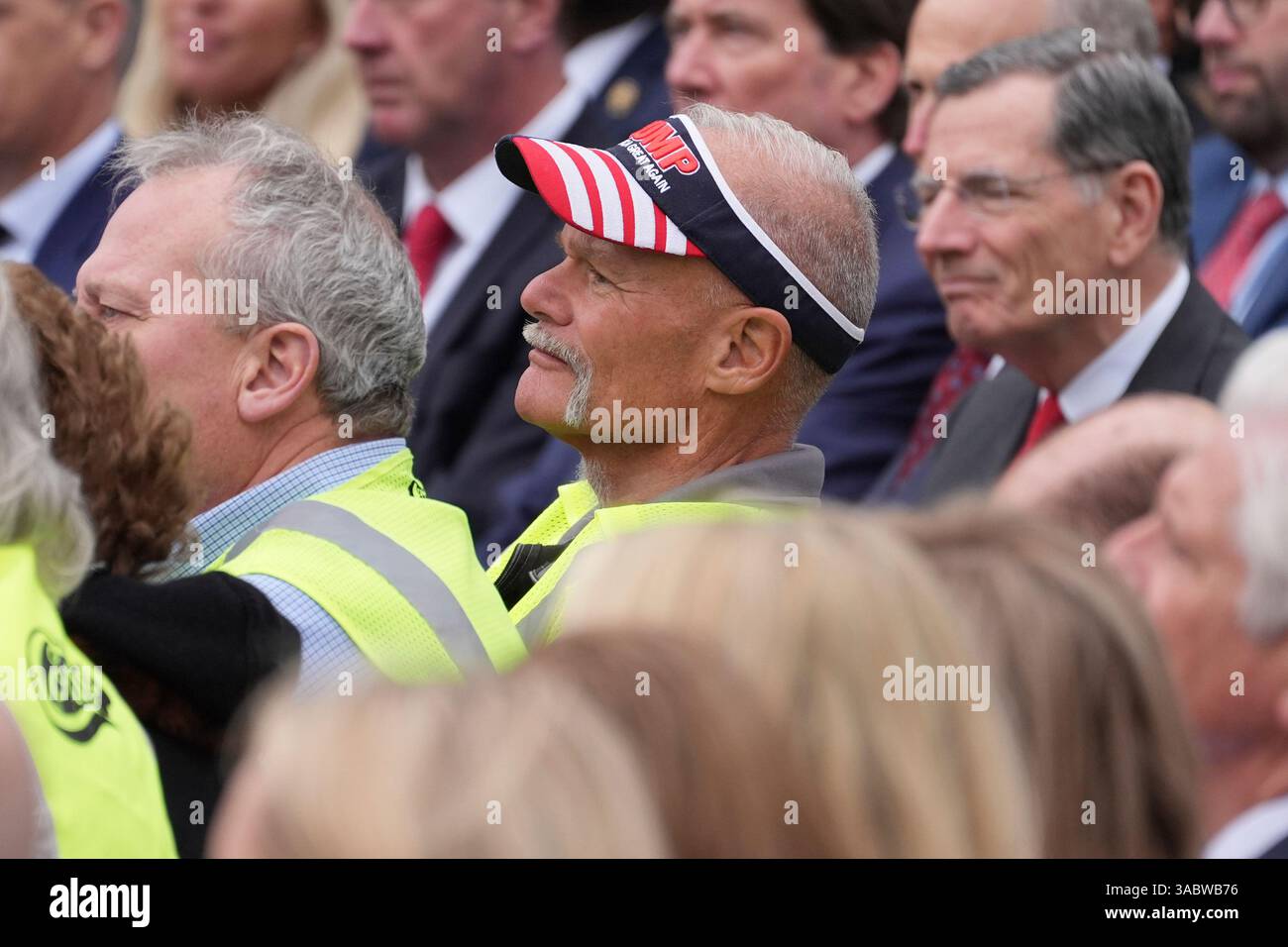 Retired autoworker Brian Pannebecker listens as President Donald Trump ...
