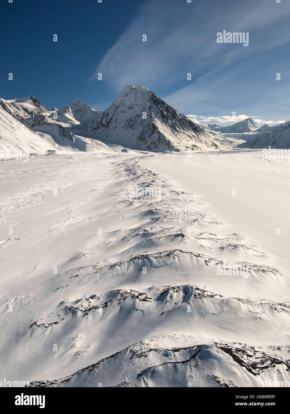 Aerial of medial moraine on Matanuska Glacier leads to Denmark Peak in ...