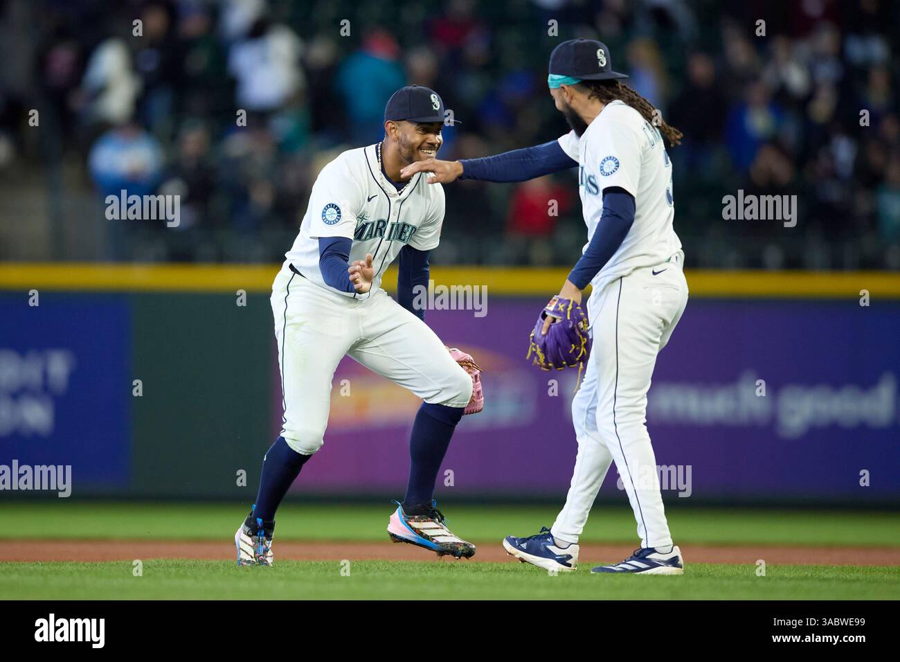 Seattle Mariners center fielder Julio Rodríguez, left, celebrates with ...