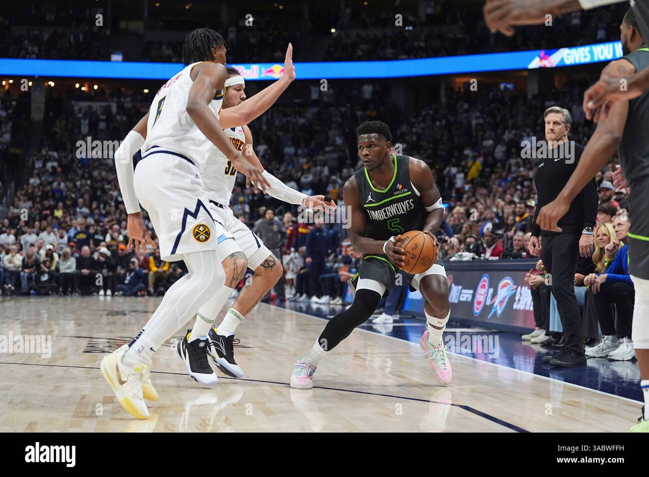 Minnesota Timberwolves guard Anthony Edwards (5) is caught with the ...