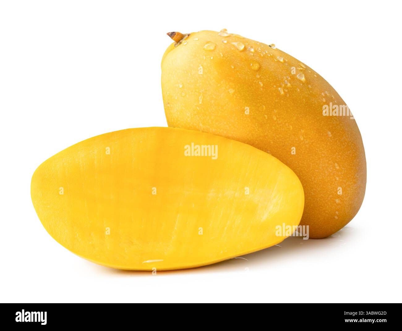 Single ripe yellow mango fruit with half and water droplets in stack is ...