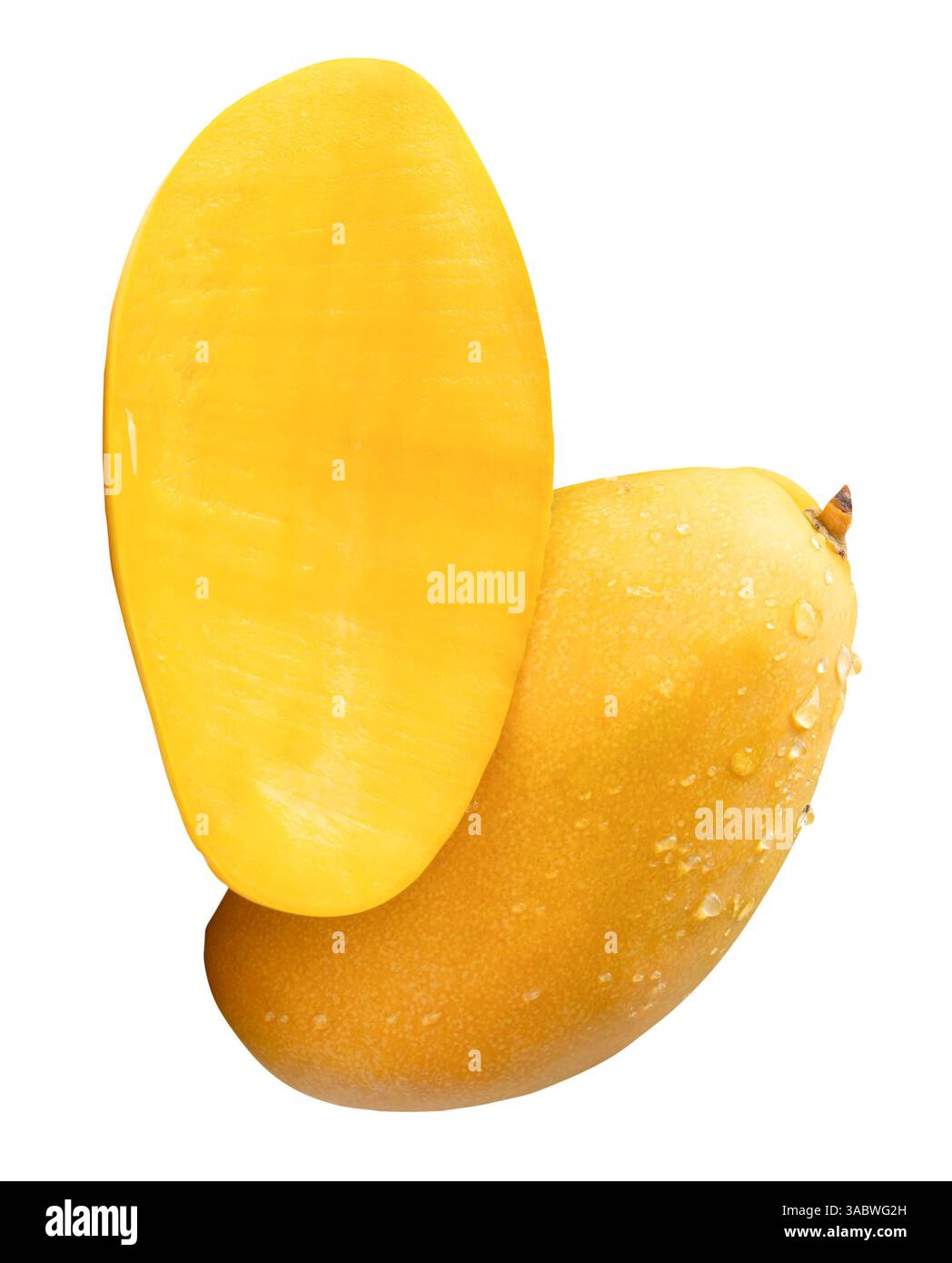 Single ripe yellow mango fruit with half and water droplets in stack is ...