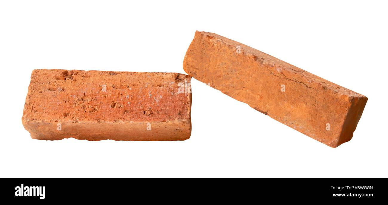 Side view of two cracked old red or orange bricks in stack is isolated ...