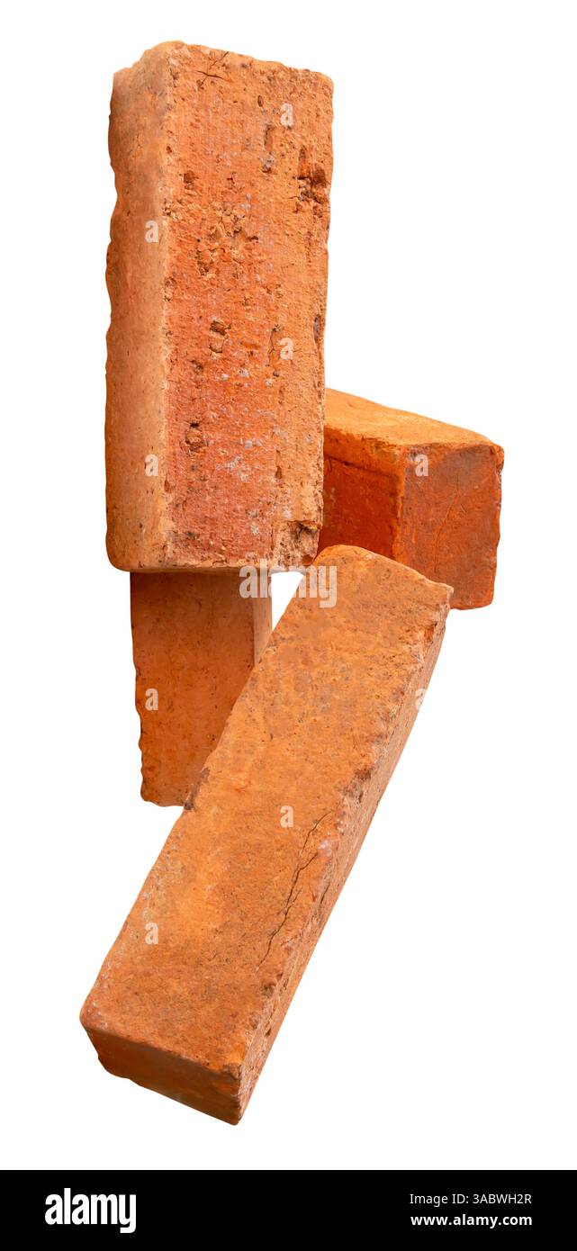 Side view of four cracked old red or orange bricks in stack is isolated ...
