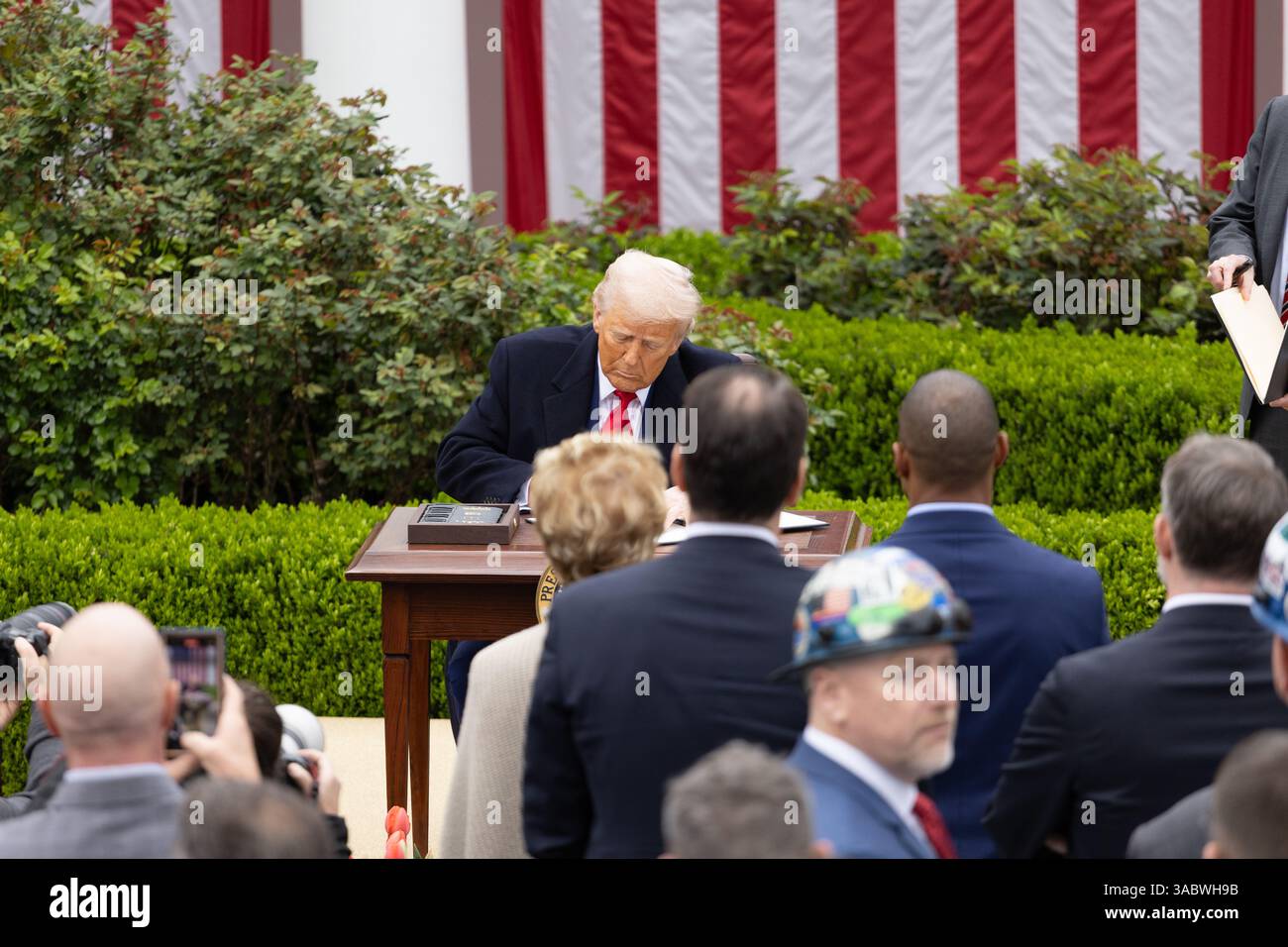Washington, USA. 2nd Apr, 2025. U.S. President Donald Trump signs an ...