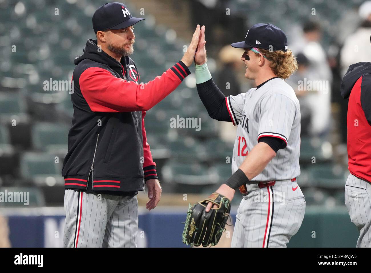 Minnesota Twins manager Rocco Baldelli, left, celebrates with Harrison ...