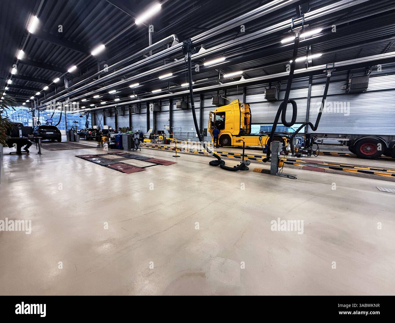 Different cars undergoing procedure of vehicle inspection at station ...