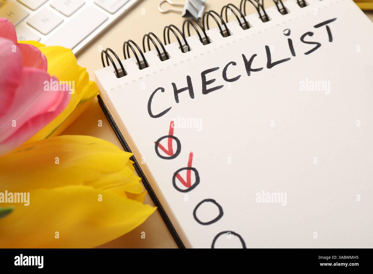 Checklist, keyboard and tulips on beige background, closeup Stock Photo ...