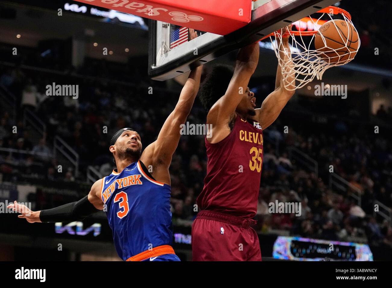 Cleveland Cavaliers forward Isaac Okoro (35) dunks in front of New York ...