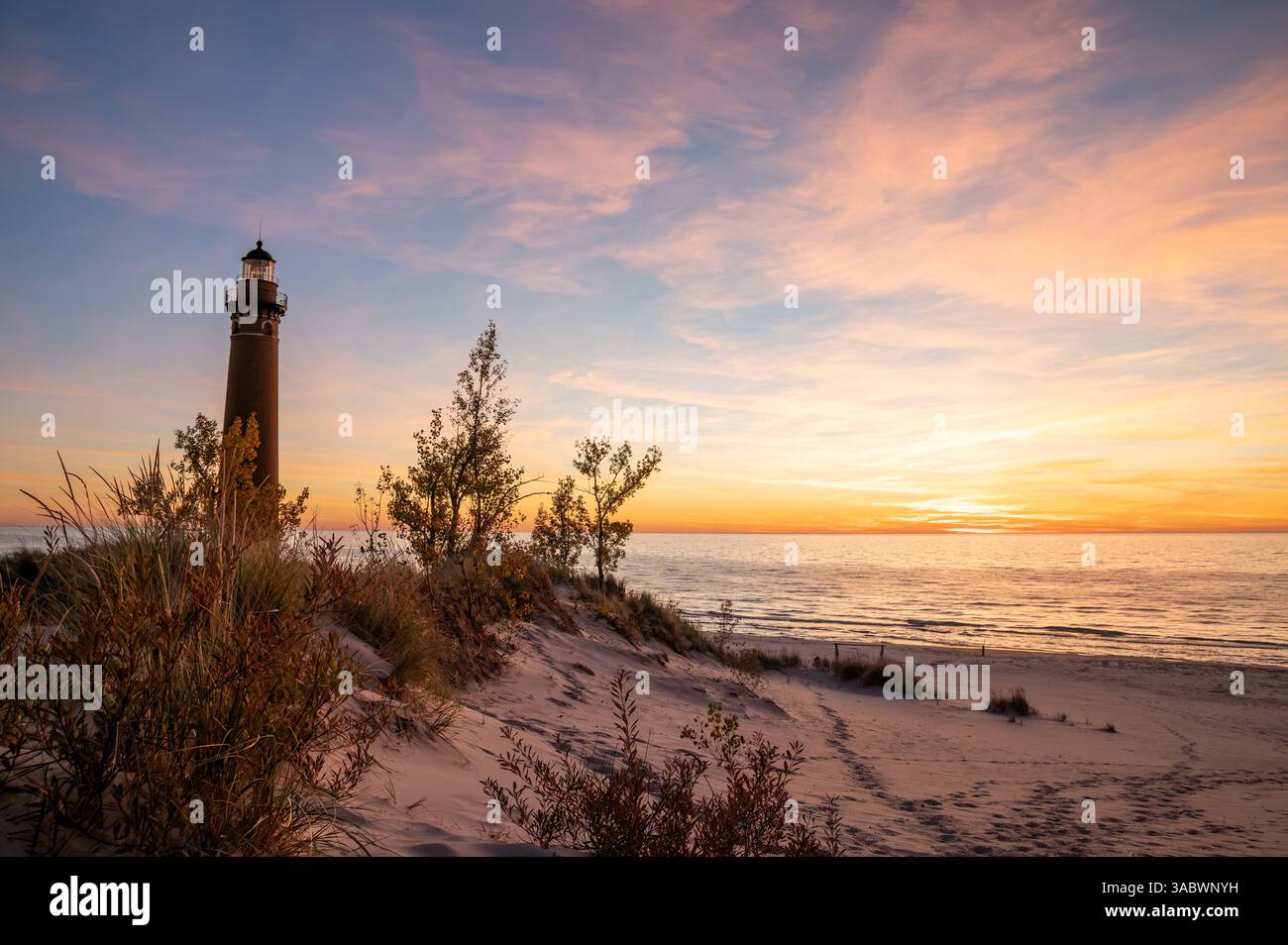 Little Sable Lighthouse behind the sand dunes on Lake Michigan at ...