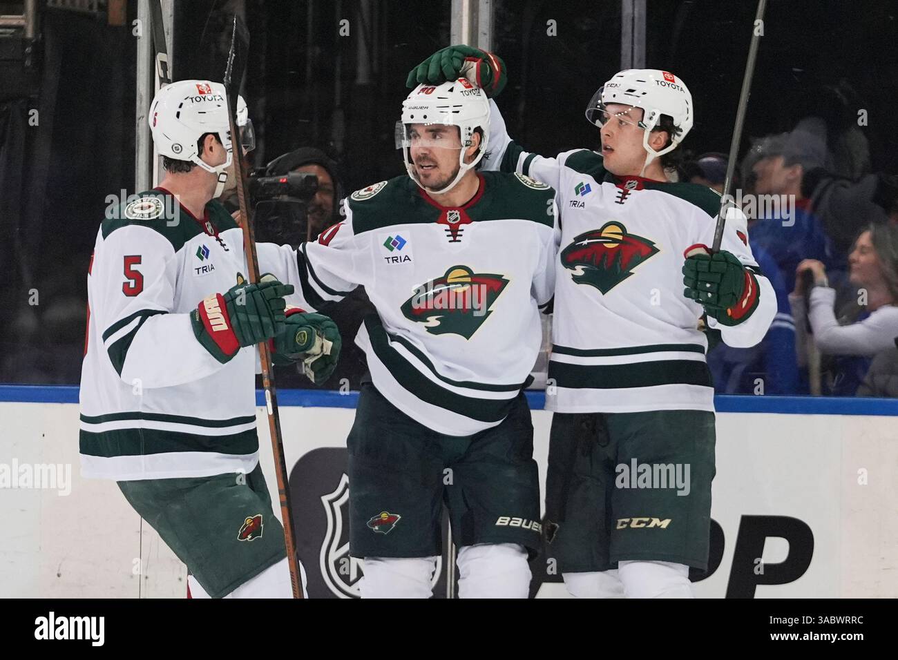 Minnesota Wild's Marcus Johansson, center, celebrates with teammates ...