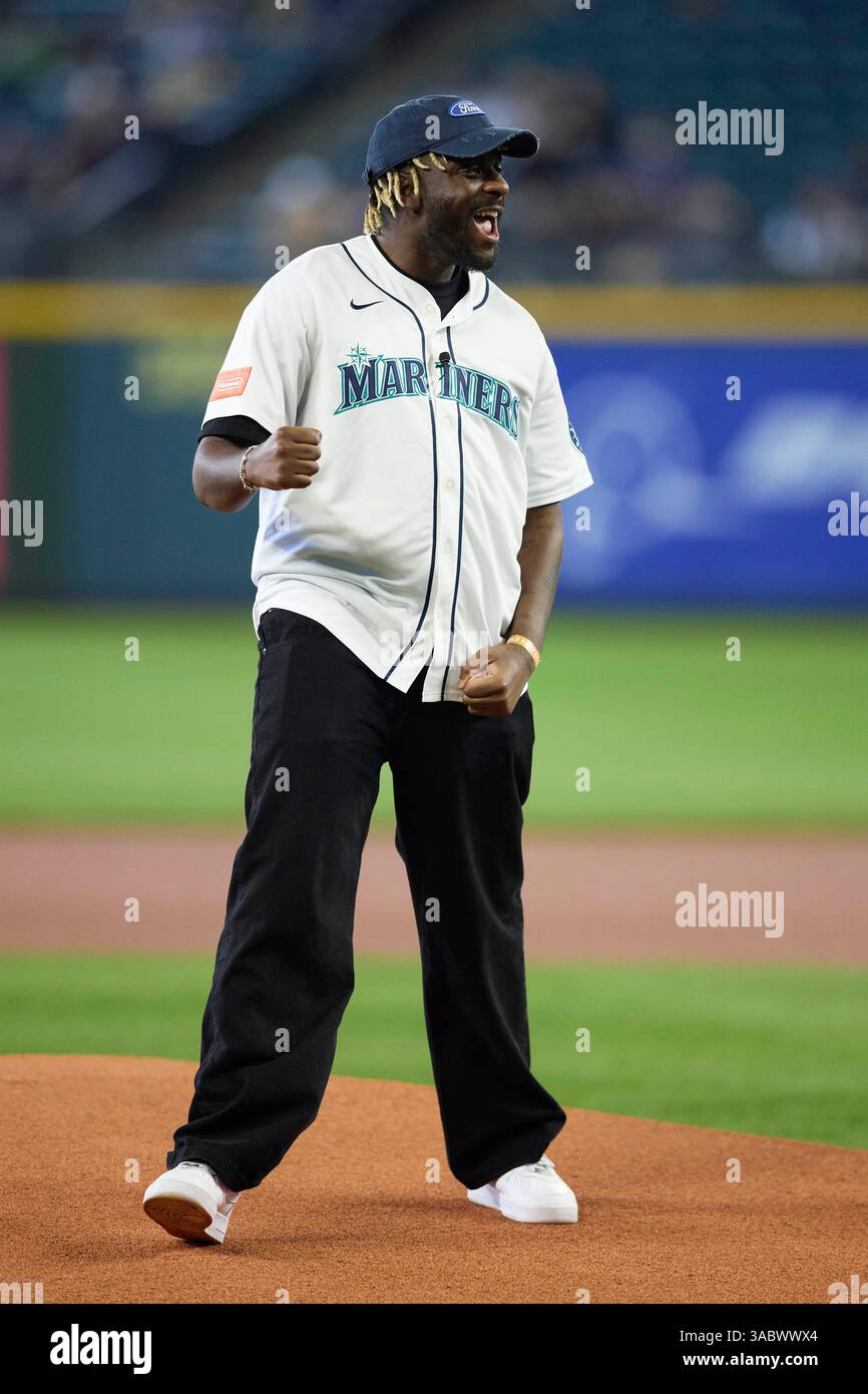 British singer Myles Smith reacts after throwing out the ceremonial ...