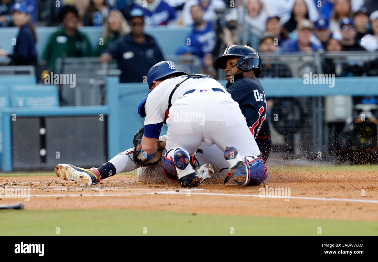 Atlanta Braves' Bryan De La Cruz, right, is tagged out by Los Angeles ...