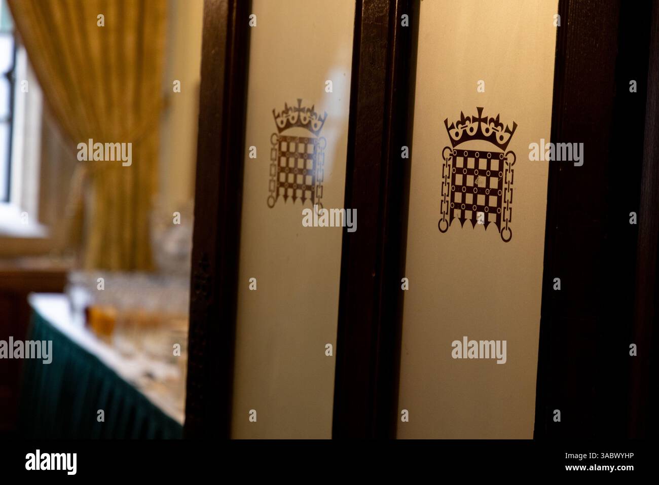 The UK Parliament emblem on a dining room door within the Houses of ...