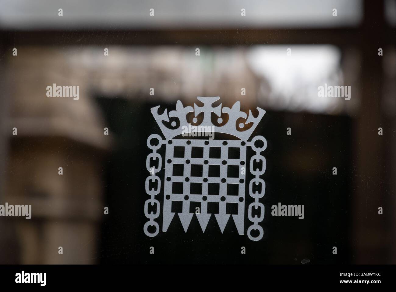 The UK Parliament emblem emblazoned on a window within the Houses of ...