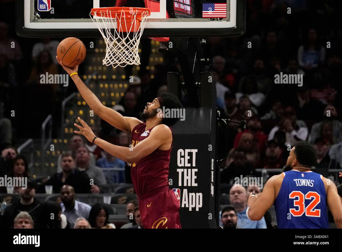 Cleveland Cavaliers center Jarrett Allen, left, shoots in front of New York Knicks center Karl ...