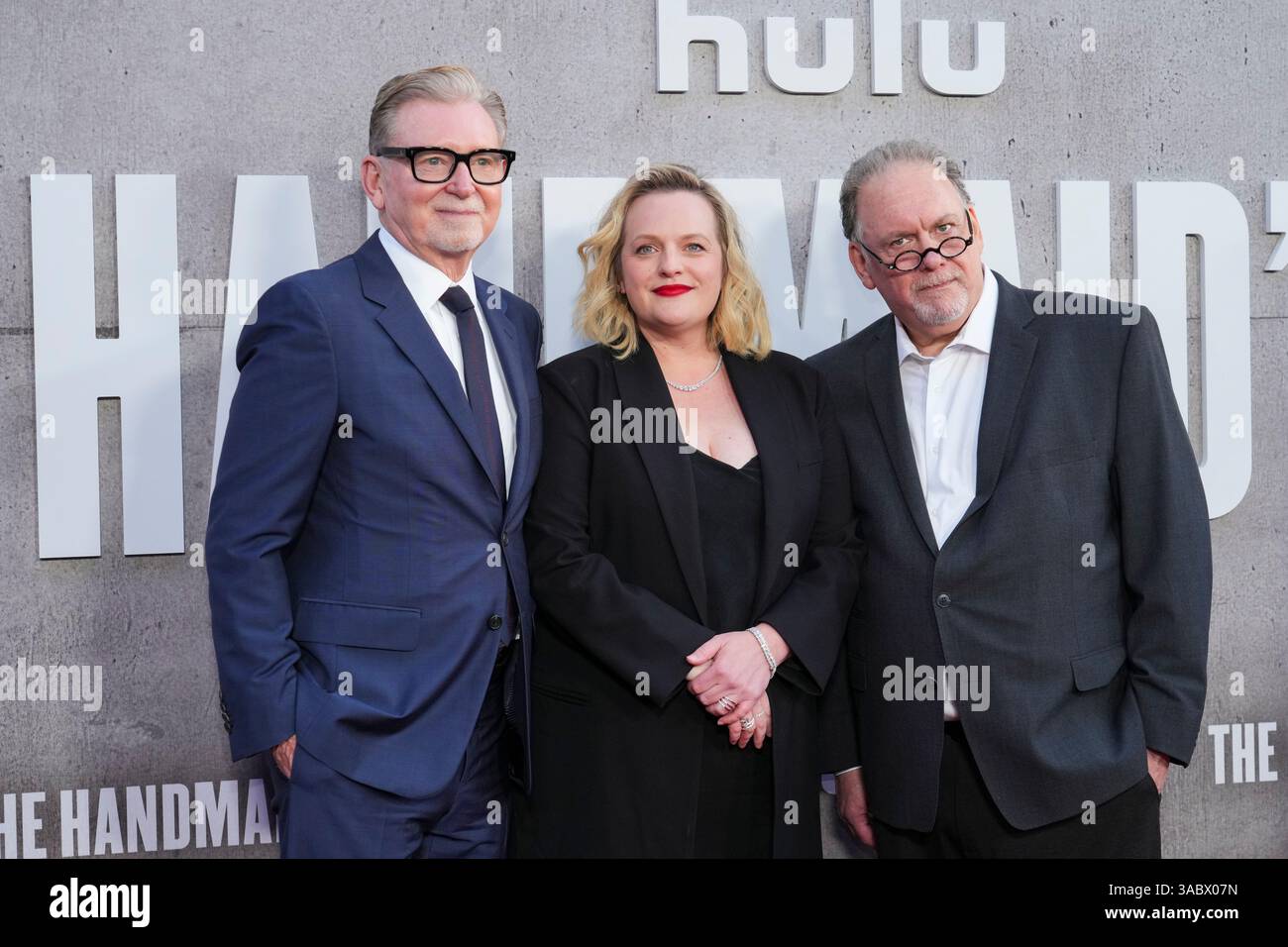 Warren Littlefield, from left, Elisabeth Moss, and Bruce Miller arrive ...