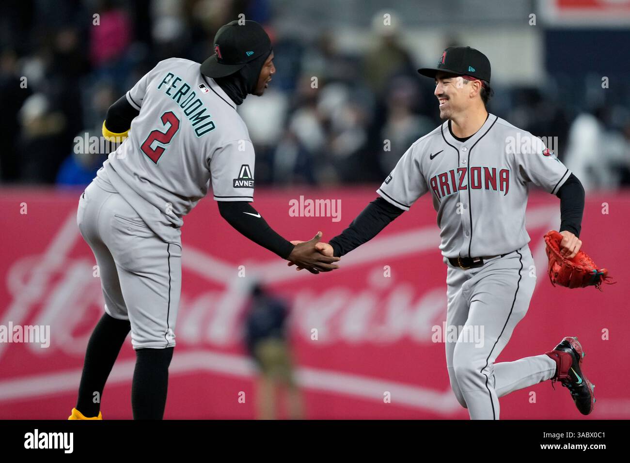 Arizona Diamondbacks shortstop Geraldo Perdomo, left, and outfielder ...