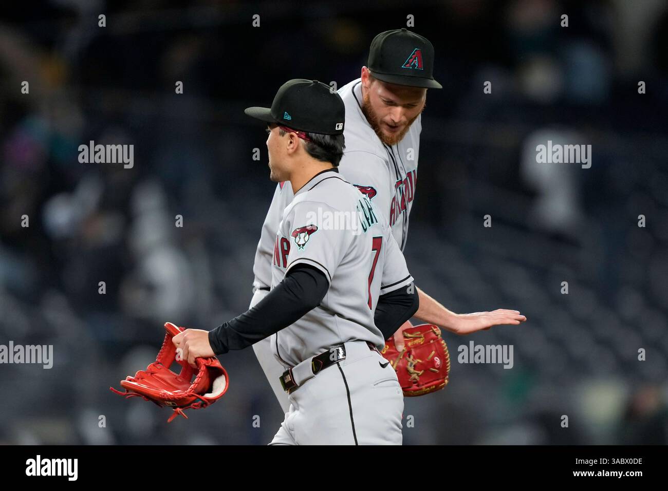 Arizona Diamondbacks pitcher A.J. Puk, right, and outfielder Corbin ...