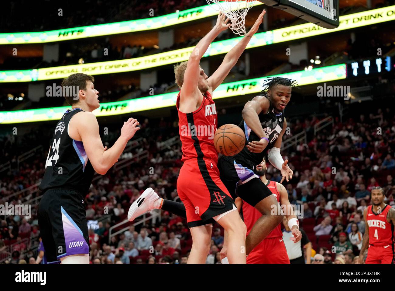 Utah Jazz guard Isaiah Collier, right, passes as Houston Rockets center ...