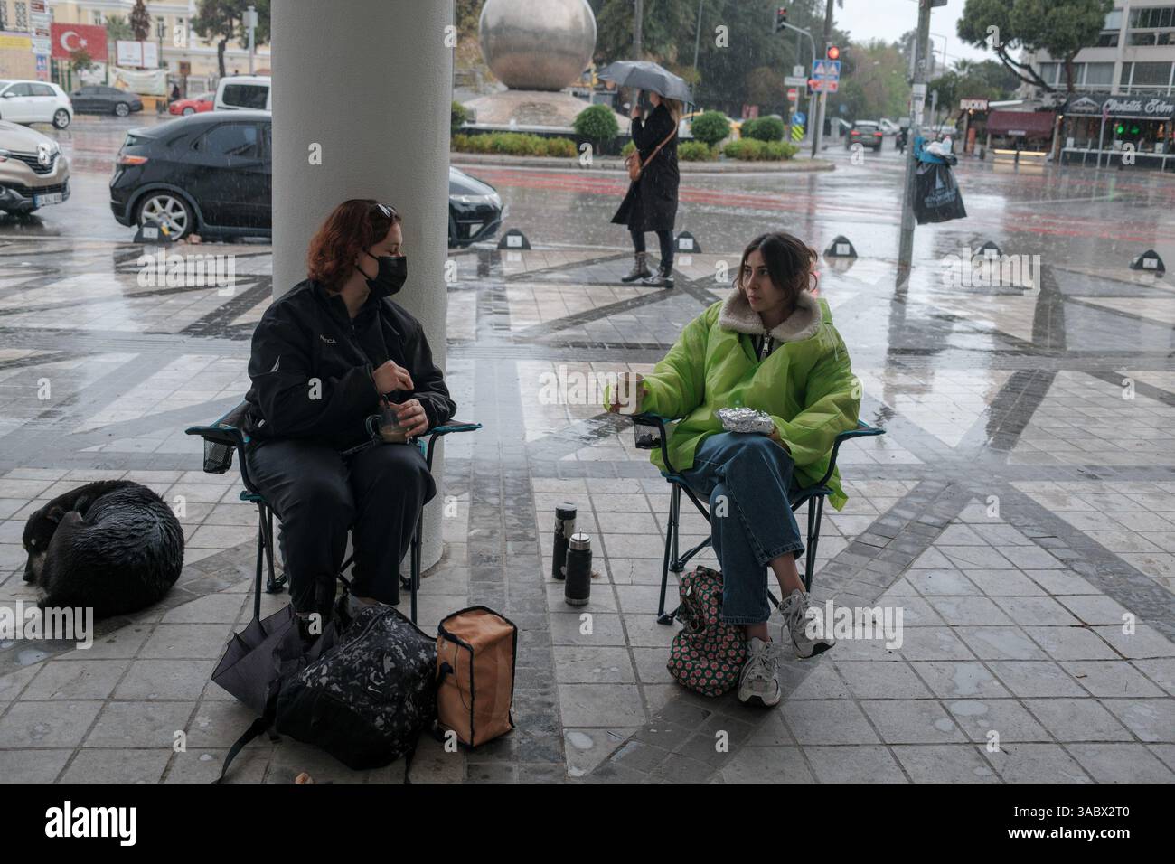 Izmir, Turkey. 02nd Apr, 2025. Women sit in the middle of the street ...