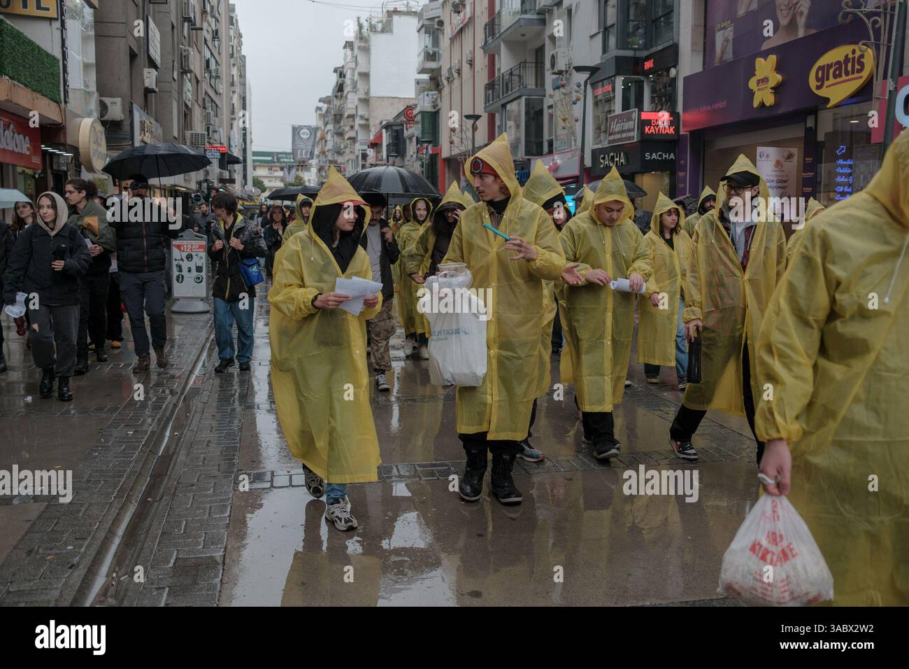Izmir, Turkey. 02nd Apr, 2025. Young people distribute leaflets urging ...