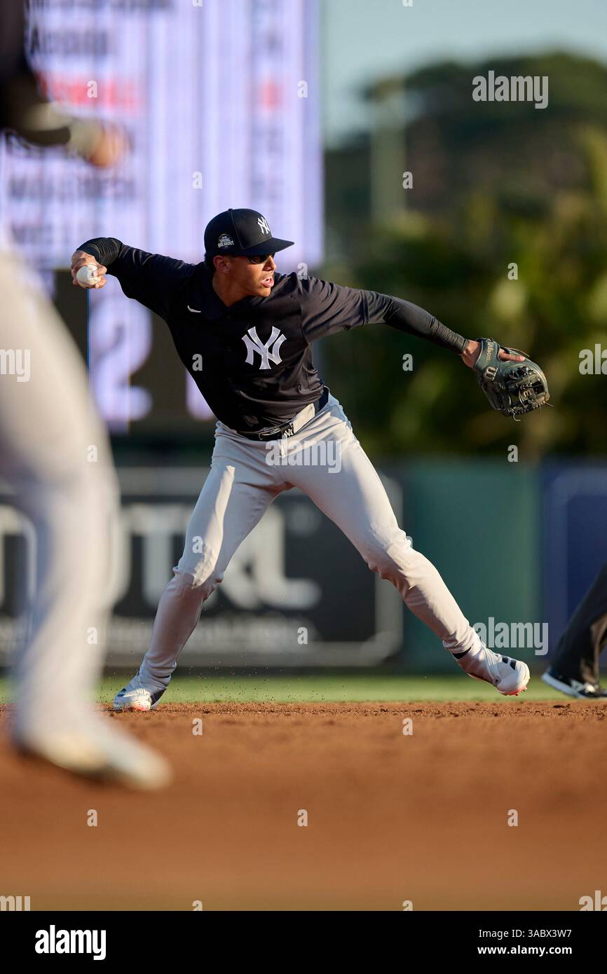 New York Yankees shortstop George Lombard Jr. (55) throws to first base ...