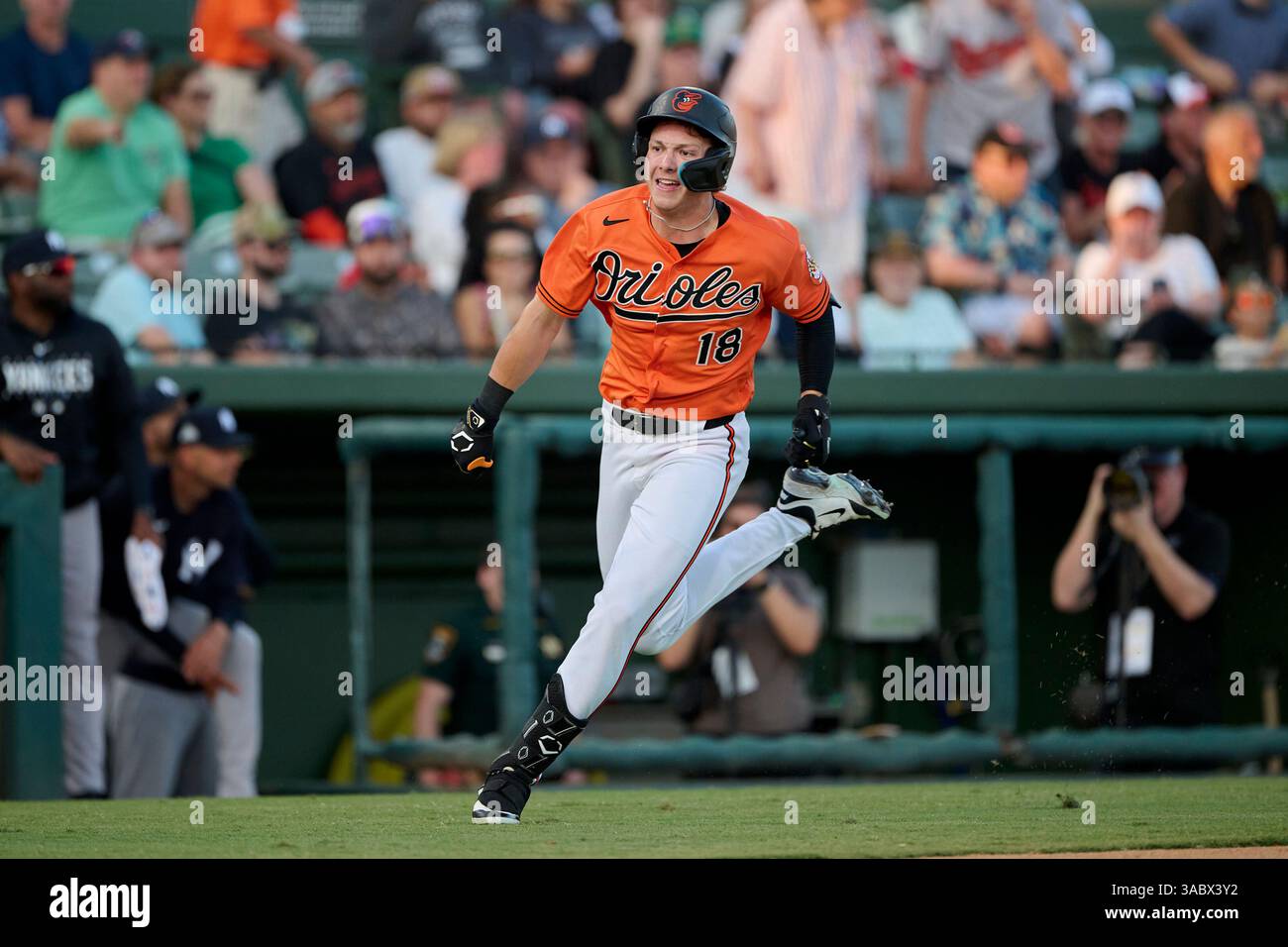 Baltimore Orioles Vance Honeycutt (18) rounds third to score after ...