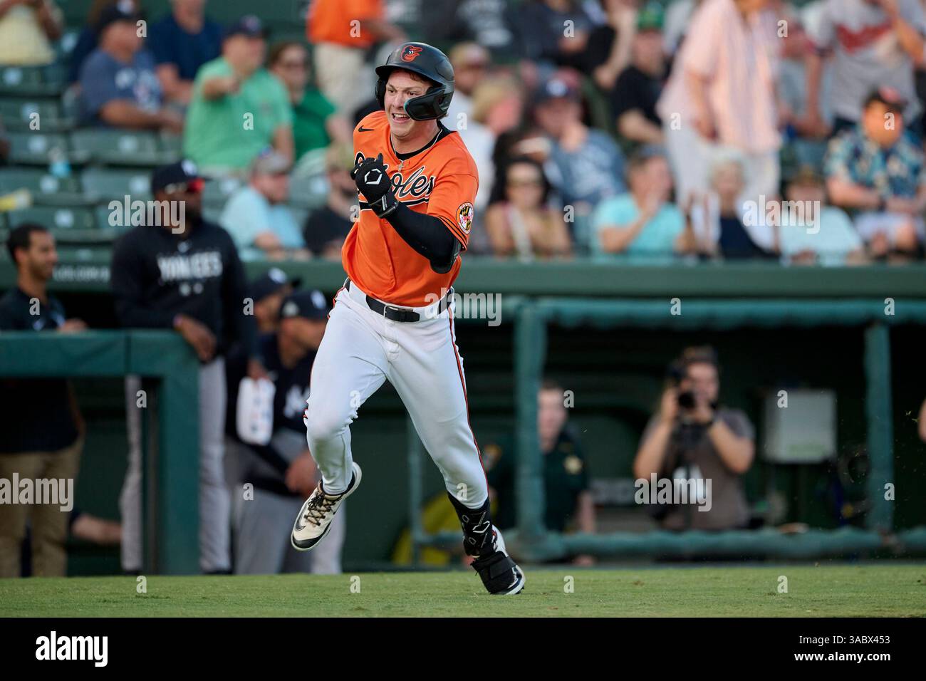 Baltimore Orioles Vance Honeycutt (18) rounds third to score after ...