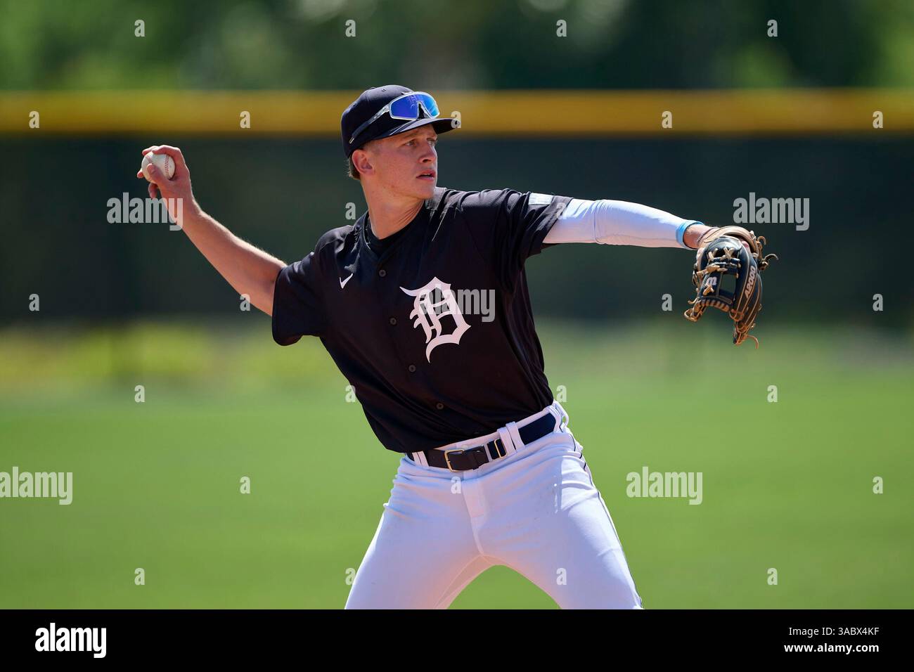 Detroit Tigers third baseman Carson Rucker (59) throws to first base ...