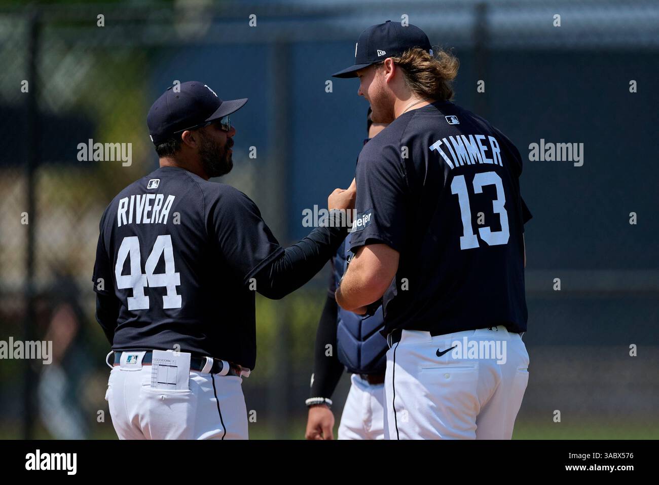Detroit Tigers manager René Rivera (44) talks with pitcher Shay Timmer (13) during an MiLB ...