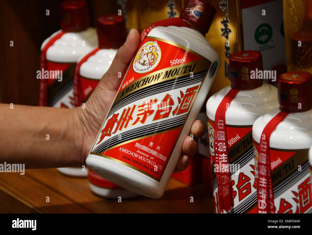 HANDAN, CHINA - JANUARY 9, 2025 - A staff member displays Kweichow ...