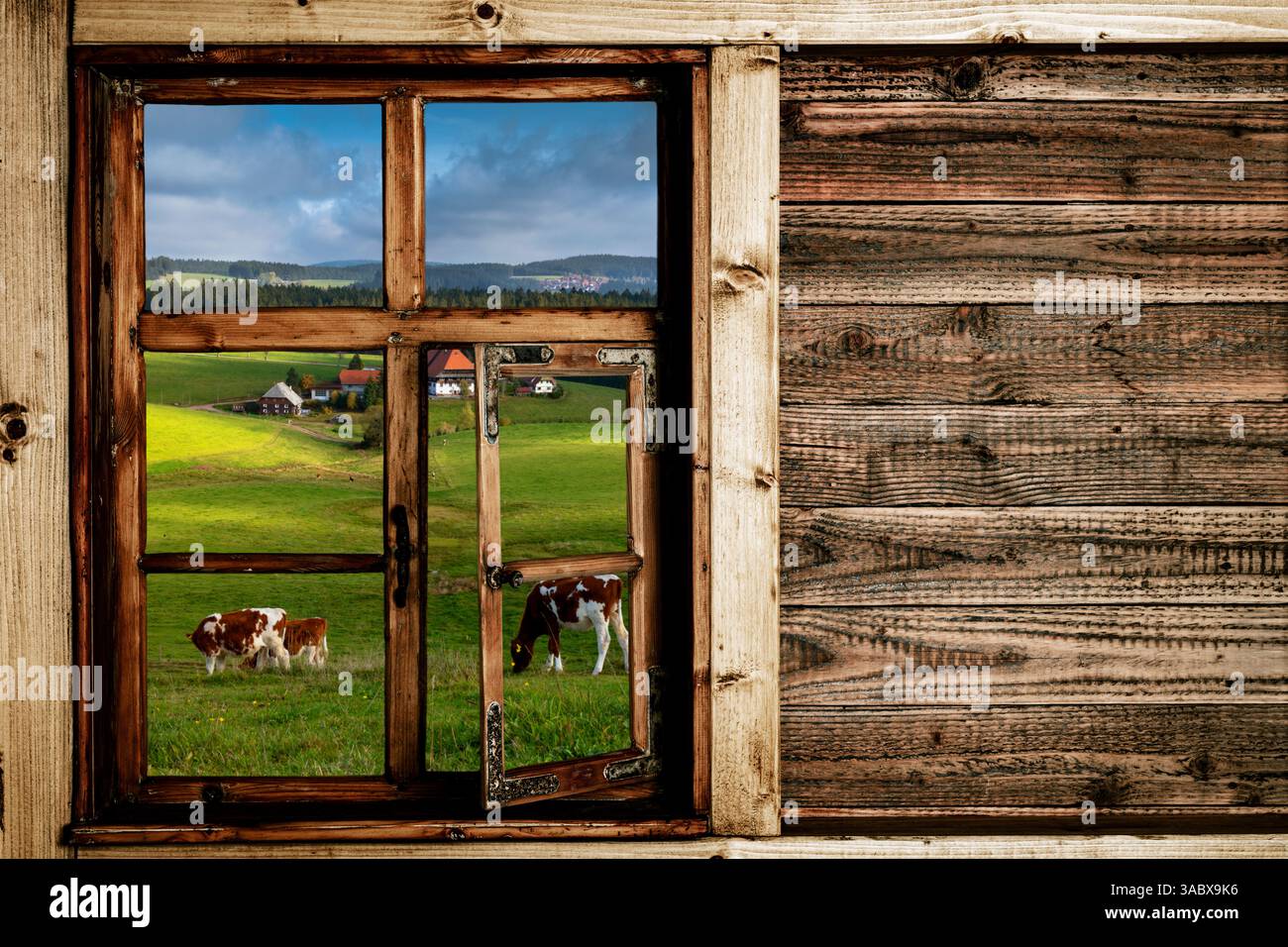 rustic farmhouse parlor with a view of the landscape from the window ...