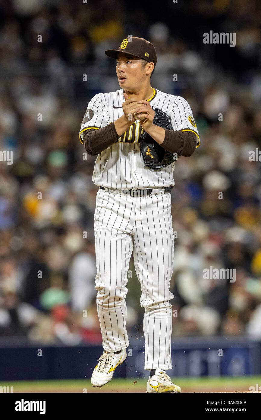 San Diego Padres relief pitcher Yuki Matsui (1) handles the ball before ...