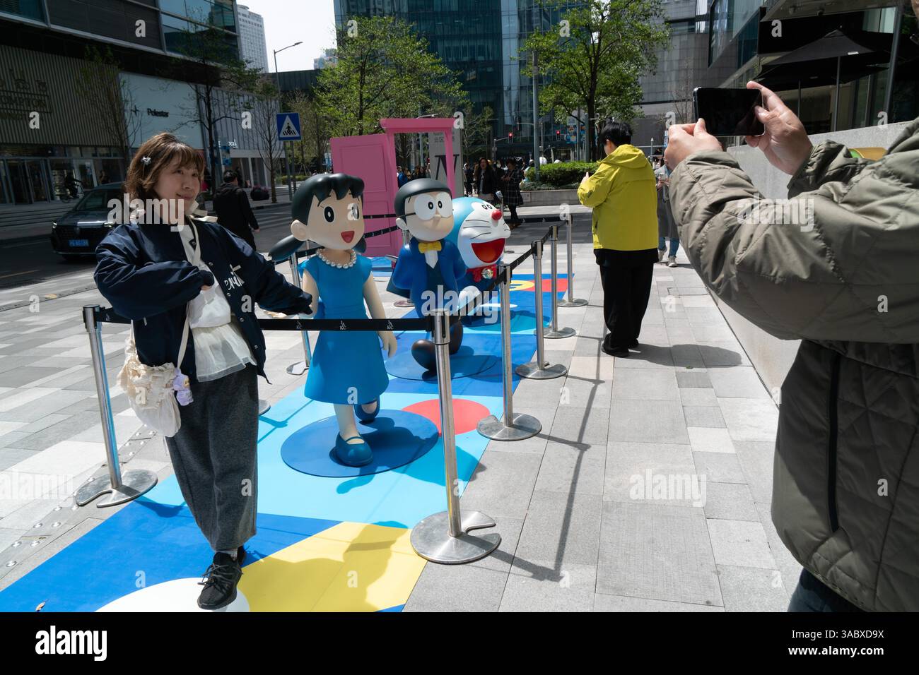 People visit a Doraemon exhibition in Shanghai, China, 31 March, 2025 ...