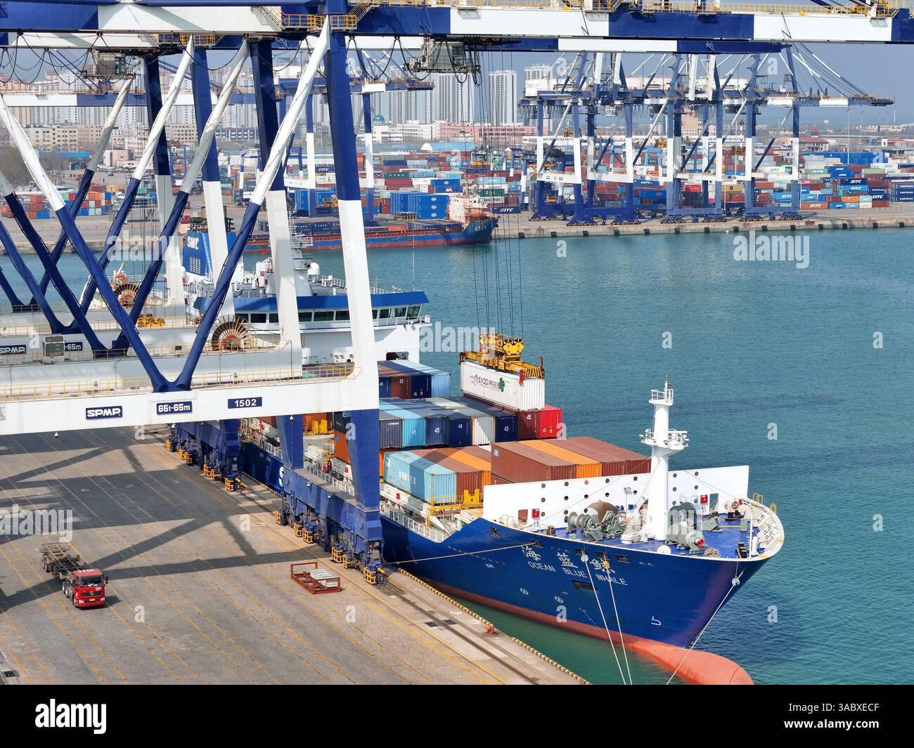 YANTAI, CHINA - APRIL 3, 2025 - A cargo ship loads containers at Yantai ...