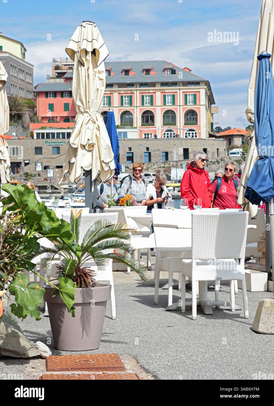 Porto Venere, Italy - 02 April 2025. Tourists on shore in bay of Porto ...